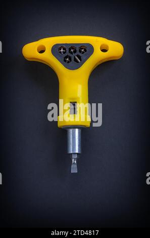 Aerial view of yellow hand screwdriver on black background Stock Photo ...