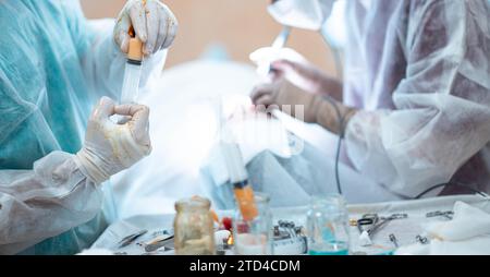Liposuction and lipofilling concept, surgery in the operating room, fat ...