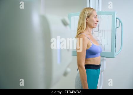 Mature woman undergoing chest radiography in clinic Stock Photo - Alamy