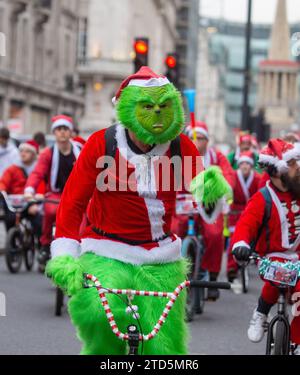 A cyclist riding his bike through Oxford Circus, London, England, UK ...