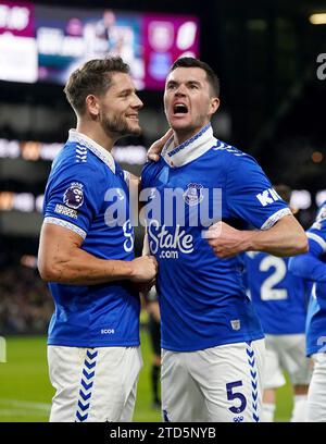 Everton's James Tarkowski (centre) celebrates scoring their side's ...