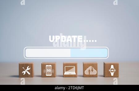 Wooden block with symbol of software update concept on blue background ...