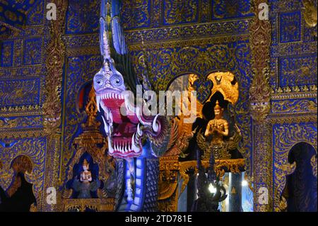 Night of Serpent front of the beauty blue chapel at Wat Rong Suea Ten ...