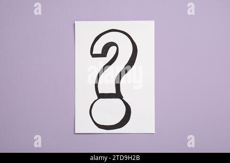 Paper with question mark on lilac background Stock Photo - Alamy