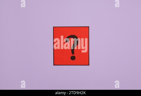 Paper with question mark on lilac background Stock Photo - Alamy