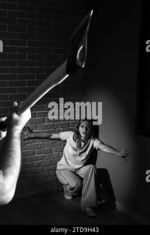 Scared Man Sitting In The Corner Of A Room With People Shadows On Wall ...