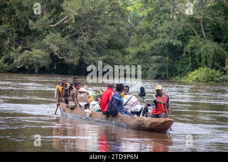 Transport of people across the Mbari river by locally made canoes and ...