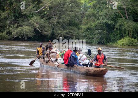 Transport of people across the Mbari river by locally made canoes and ...