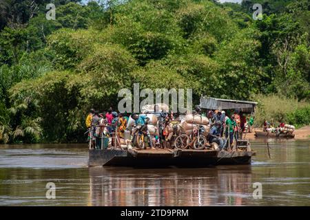 Transport of people across the Mbari river by locally made canoes and ...