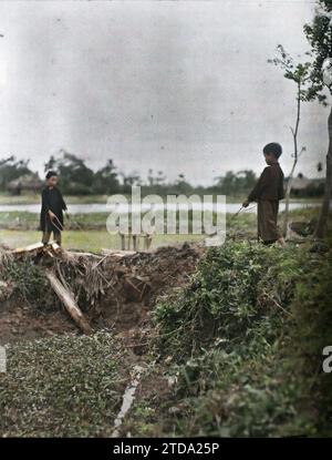 Tonkin, Indochina Children using a bucket with strings, elevating water ...