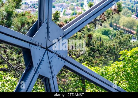 Triangular metal grid structure on top of a building Stock Photo - Alamy