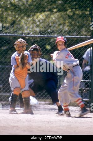 KINGS POINT, NY - 1960'S: General view of a child sliding back to the ...