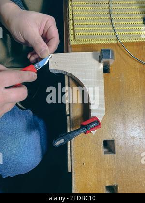 violin maker artisan cutting fillet purfling with tool to join other ...