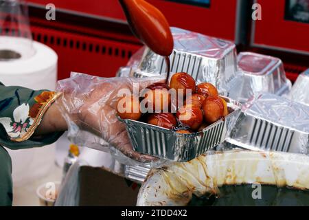 arabic street food Logma or Legaimat (Lugaimat) preparation, is one of ...