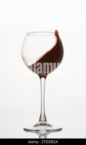 Red wine diagonal wave, curl is in stemmed glass Stock Photo - Alamy
