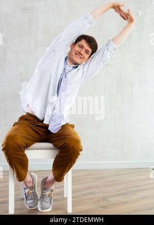 Physical jerks for office workers on chair Stock Photo - Alamy