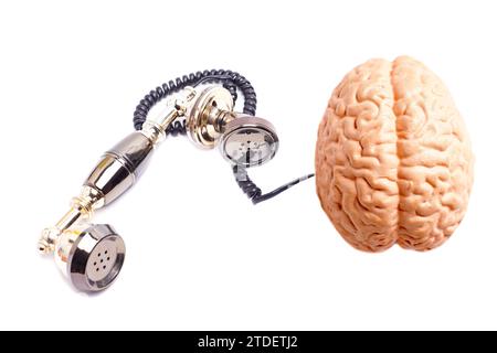 Vintage telephone receiver with human brain anatomical model isolated ...