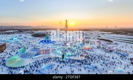 Tourists visit the Harbin Ice and Snow World during the peak ice-snow ...