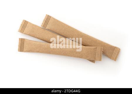 three sugar sticks, sugar in paper kraft packaging, mock up for design ...