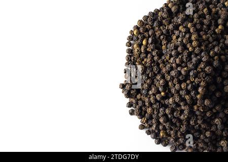 Ground black pepper piled in triangular white bowl. Garlic bulb green ...