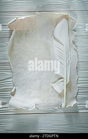 Quill vintage paper sheet on wooden board Stock Photo - Alamy