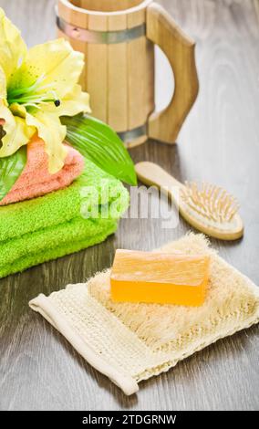 Soap and bathing accessories on wooden background Stock Photo - Alamy