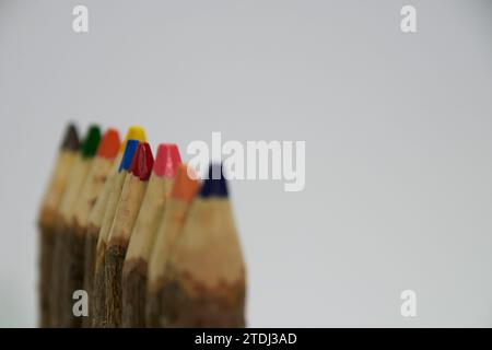 Original colored pencils, made with tree branches of the same size on a ...