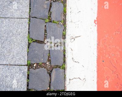Border between running track and street paving stones. Treadmill ...