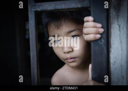 The child captured the iron cage with sadness and despair. The concept of stopping violence ...