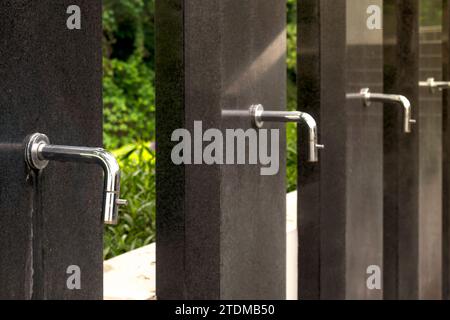 A row of water tap ablution places for Muslims before entrance or ...