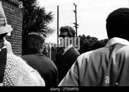 Director DON SIEGEL (at far left) and CLINT EASTWOOD on set location ...