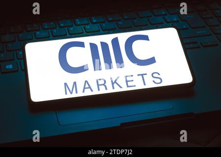 In this photo illustration, the CMC Markets logo is displayed on a ...