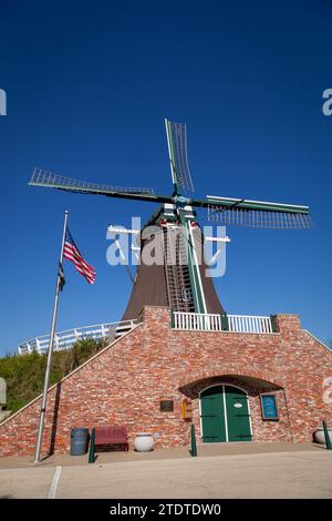 An old windmill on a bank of a river in Bredevoort, Netherlands on a ...