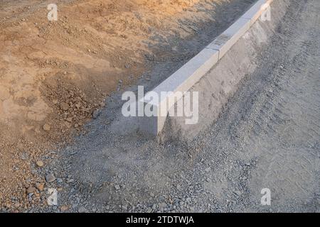 Concrete curb border laid on cement. road safety Pavement construction ...