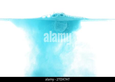 Light blue bath bomb in water on white background Stock Photo - Alamy