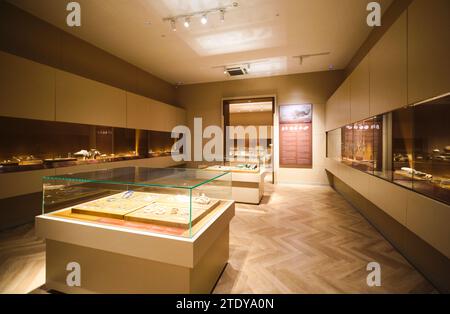 A gallery displaying ancient archeological artifacts and pottery, vases ...