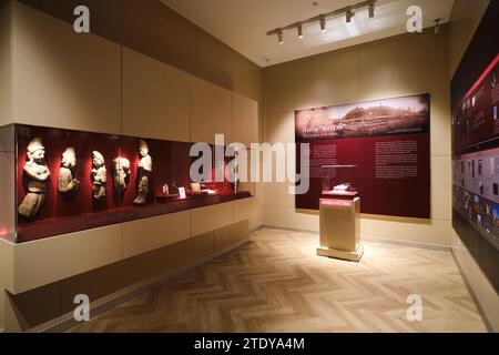 A gallery displaying ancient archeological artifacts and religious ...