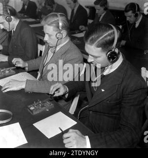 Men training on telegraph keys for World War II telegraph operator work ...