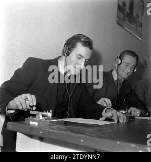 Men training on telegraph keys for World War II telegraph operator work ...