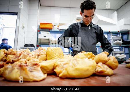 ROTTERDAM - Employees of a poulterer process orders the day before ...