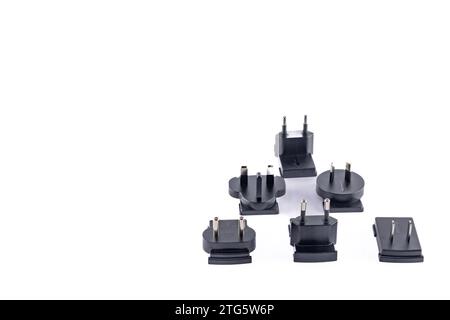 European, Chinese, American electrical socket plug on white table Stock ...