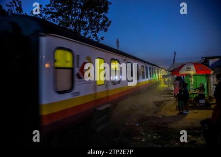 The late evening Nairobi to Kisumu passenger train drives past Kibera ...