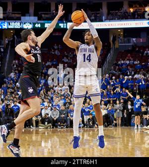 UConn forward Alex Karaban (11) goes up for a basket against UMass ...