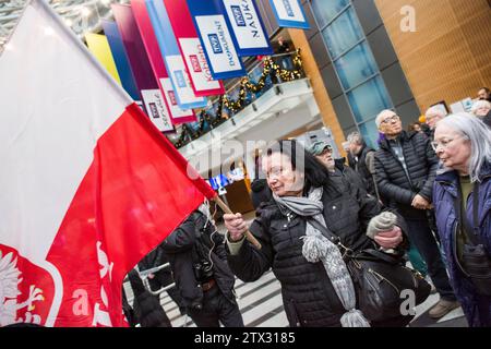 a waving Polish flag and the Polish Television TVP logo in the ...