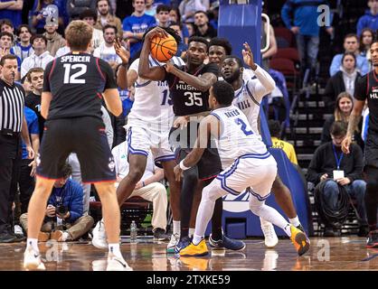 UConn center Samson Johnson (35) flexes after making a basket in the ...