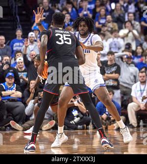 UConn center Samson Johnson (35) flexes after making a basket in the ...