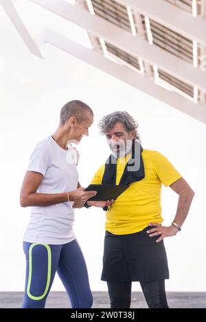 man and trainer watching progress of training Stock Photo - Alamy