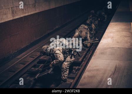 Image of a SWAT group sneaking along the rails in the subway. Special ...