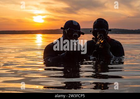 Team of fighters of a special unit move on water to complete the task ...