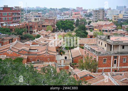 JINJIANG, Dec. 21, 2023 (Xinhua) -- Tourists take photos at a Minnan ...